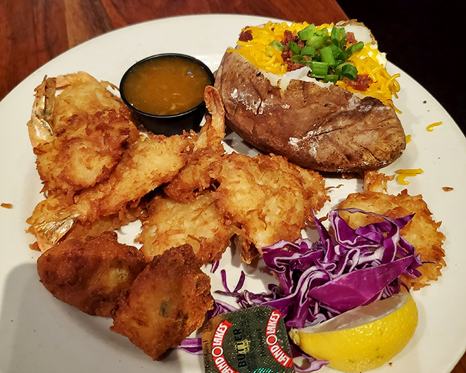 Golden-fried coconut shrimp that could make a pescatarian weep with joy. That loaded baked potato isn't playing second fiddle to anyone.