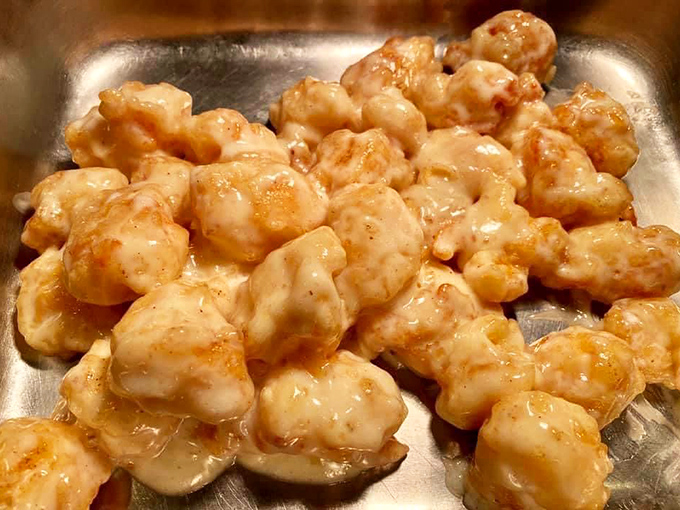 These coconut shrimp glisten with sweet promise, like little nuggets of tropical vacation waiting to transport your taste buds to island time.