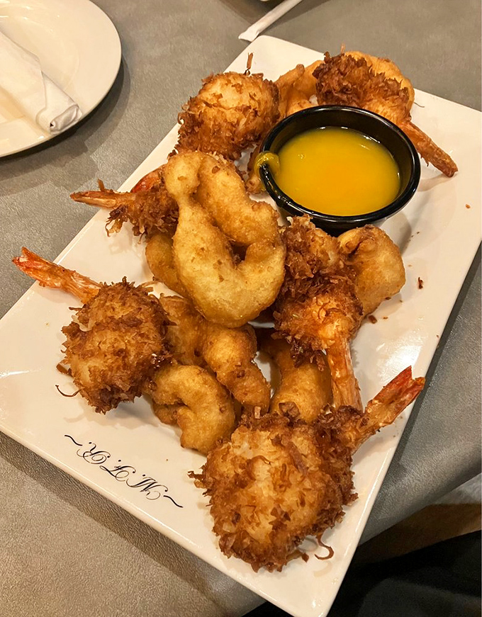 Golden-fried coconut shrimp with a crunch so satisfying it deserves its own sound effect. The dipping sauce is just the encore.