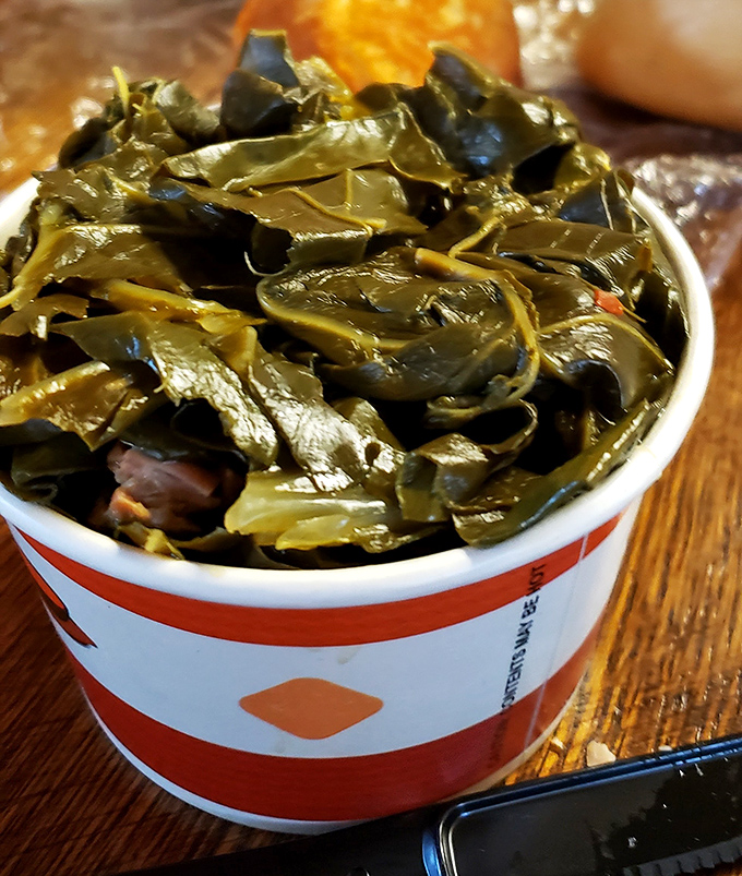 Collard greens that have clearly been cooking with purpose. Not just a side dish, but a statement about how vegetables should be treated.