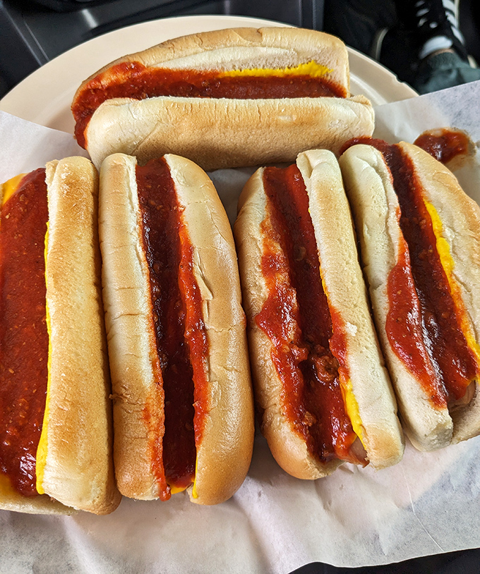 Coney dogs lined up like soldiers ready for delicious duty. That sauce isn't trying to impress food critics—it's trying to impress your memory.