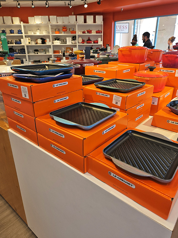 Le Creuset's signature orange boxes housing cast iron treasures that will outlive your kitchen renovations and possibly your mortgage.