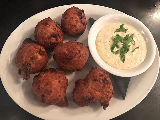 These corn fritters arrive looking like golden nuggets of joy, ready for their creamy co-star.