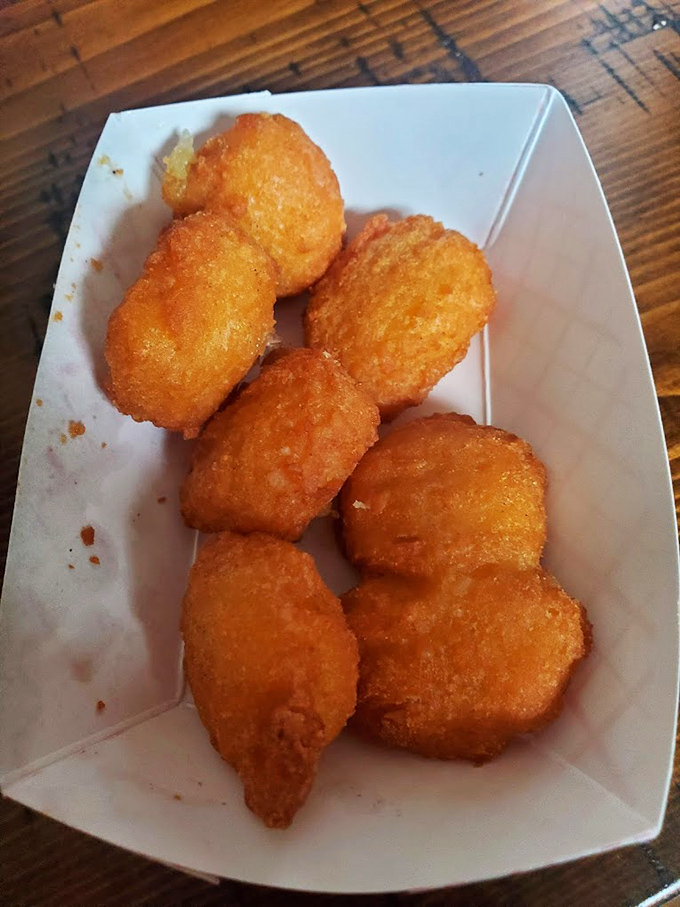 Golden-fried corn nuggets that crunch like your favorite childhood memory. These little pockets of creamed corn goodness might be worth fighting over.