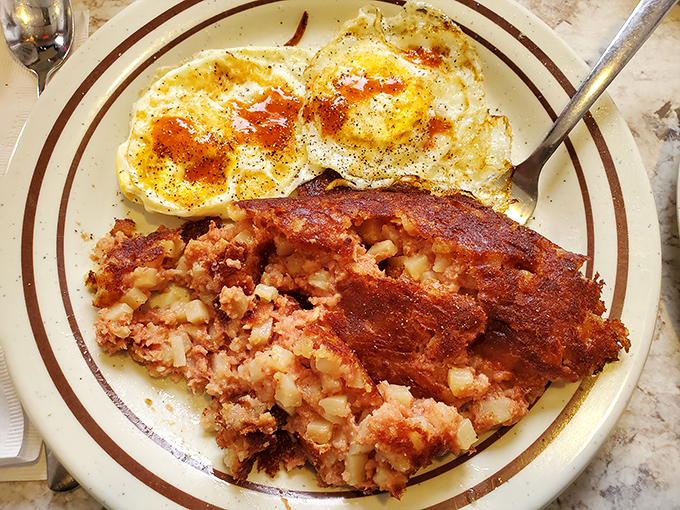 Corned beef hash with that perfect crispy edge, eggs with just-right yolks &ndash; breakfast nirvana exists, and it's served on a simple diner plate.