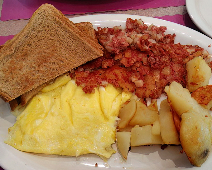 A breakfast plate that speaks Pennsylvania's love language: perfectly scrambled eggs, crispy corned beef hash, and home fries worth fighting over.