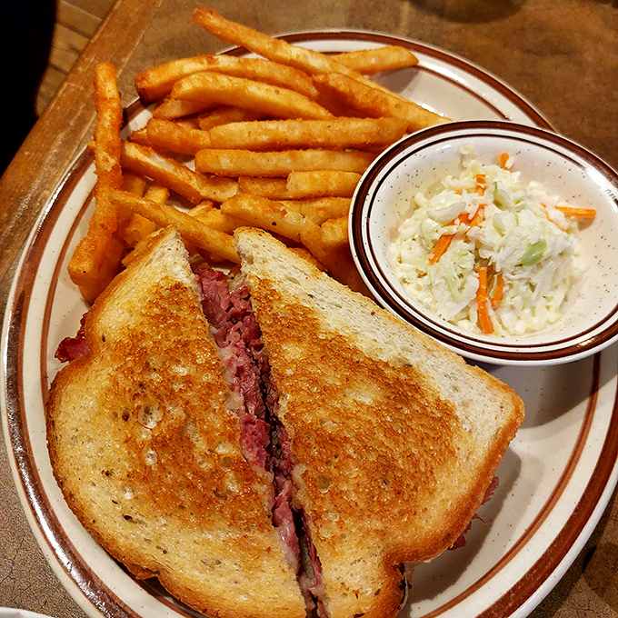 This isn't just a sandwich&mdash;it's an architectural masterpiece of perfectly grilled bread embracing tender corned beef in a warm, melty hug.