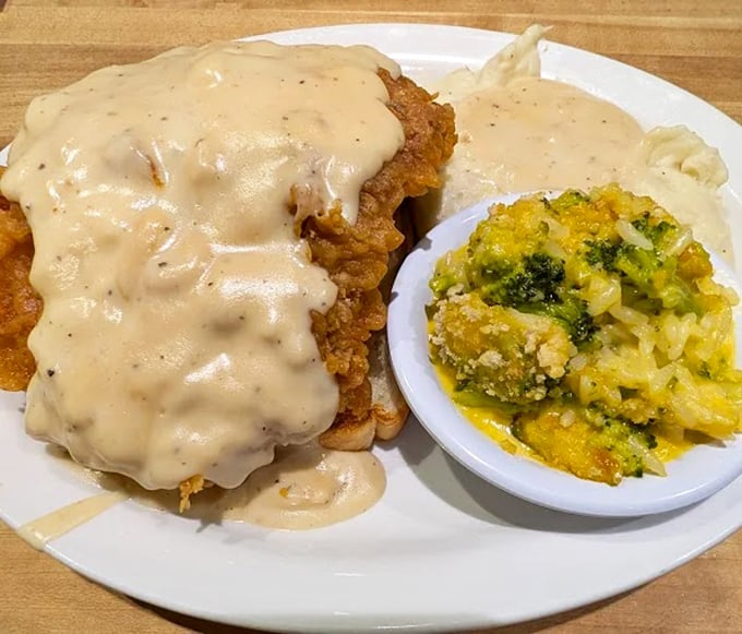 Country fried steak smothered in gravy alongside cheesy broccoli casserole&mdash;a plate that whispers "you might need a nap after this" in the most delicious way.