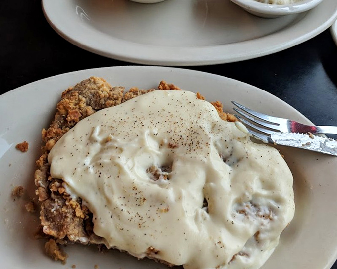 Country fried steak blanketed in peppery gravy that would make your grandmother jealous and your cardiologist concerned.