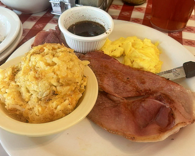Country ham with red-eye gravy alongside fluffy eggs and a biscuit that could make a grown person weep. Breakfast doesn't get more Tennessee than this.