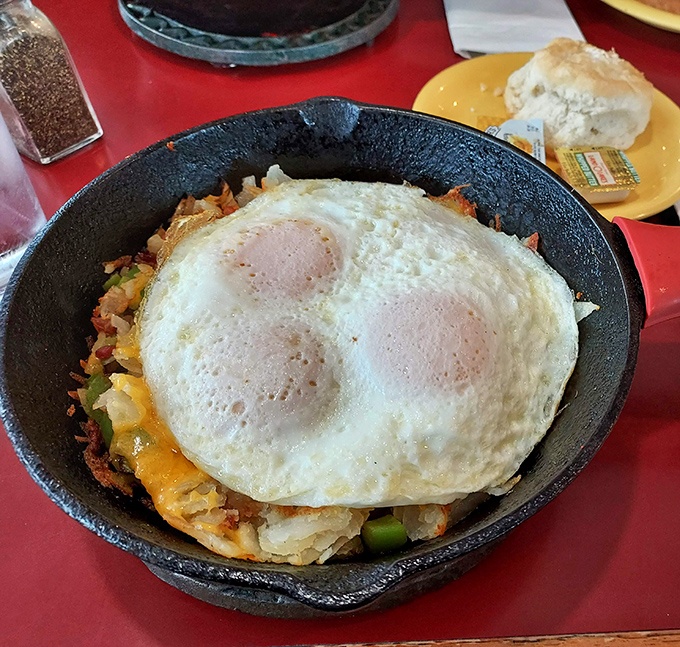 This sizzling skillet masterpiece topped with perfectly cooked eggs proves that sometimes the best canvas for breakfast is cast iron.