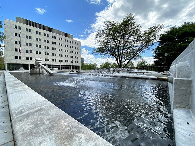 The courthouse plaza creates a perfect stage for this judicial giant. It's like the world's most intimidating game of "This is Your Gavel on Steroids."
