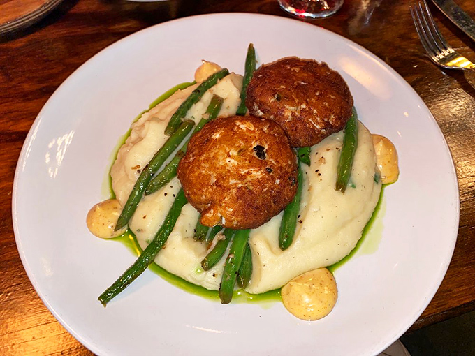 These crab cakes aren't playing around&mdash;perched atop creamy mashed potatoes with green beans standing at attention like tasty little soldiers.
