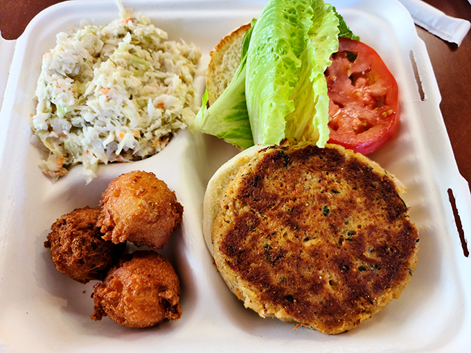 The crab cake sandwich arrives with no pretense, just pure Eastern Shore authenticity. Those hush puppies aren't just sides&mdash;they're little orbs of cornmeal joy.