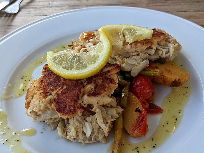 Crab cakes that actually deserve the name&mdash;mostly crab, barely cake, served with roasted vegetables that didn't just show up as an afterthought.