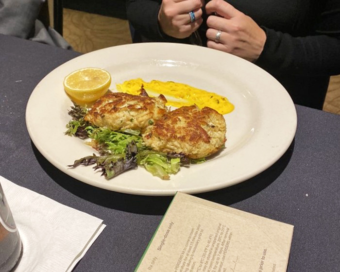 These crab cakes aren't playing games &ndash; all meat, minimal filler, and a golden crust that sings with each bite.
