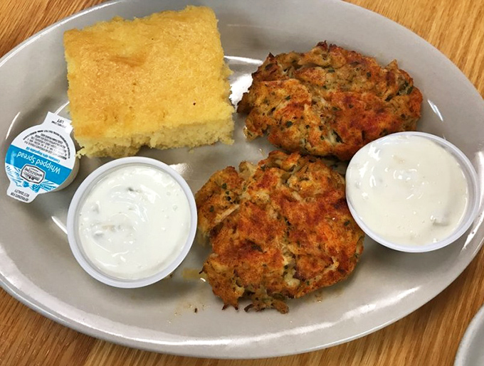 Crab cakes that are all crab, barely held together by hope and a prayer. The cornbread square is just a bonus.