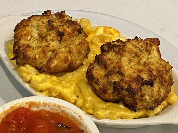 Crab cakes that could make Maryland nervous. Golden-brown exteriors give way to lump crabmeat interiors, perched majestically atop creamy mac and cheese.