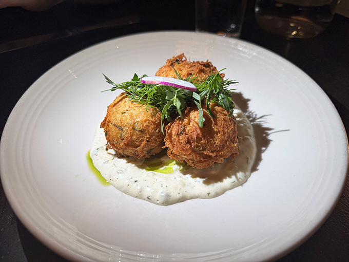 Crab fritters that could convert the most devoted hush puppy enthusiast. Crispy orbs of oceanic delight resting on a cloud of sauce.