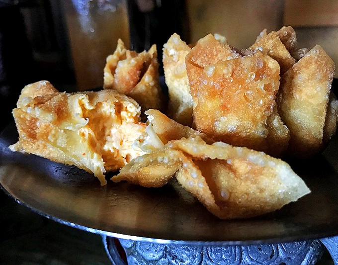 Crab Rangoon with the perfect crunch-to-cream ratio&mdash;little golden pillows that disappear faster than Florida sunshine.