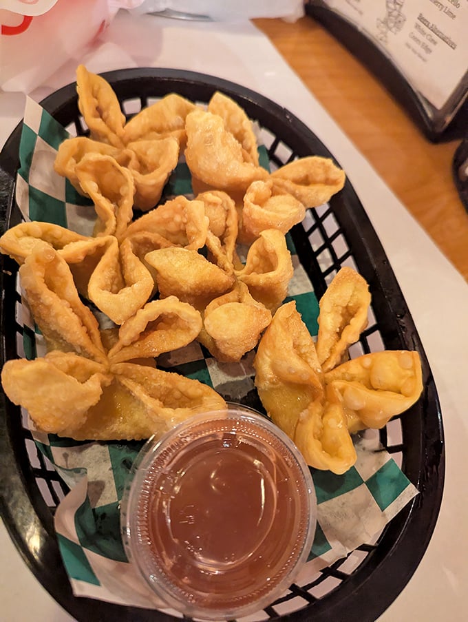 Golden-fried crab rangoons with that perfect crunch-to-cream ratio&mdash;the kind that makes you wonder why you'd ever share an order.