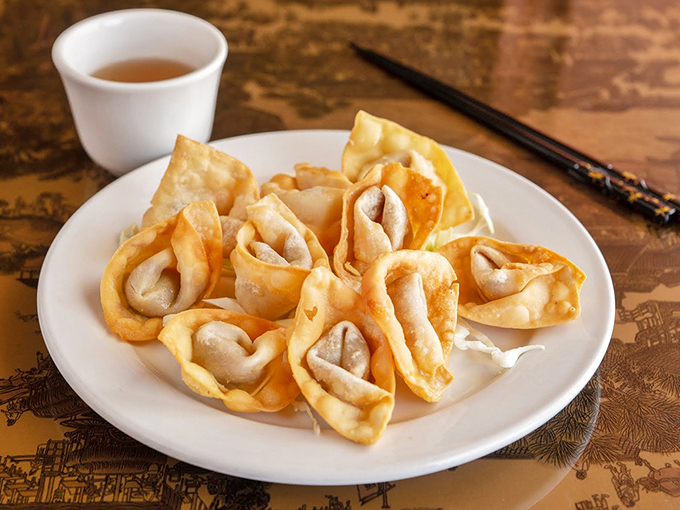 Fried wontons with the perfect crunch-to-filling ratio. These golden pockets of joy make sharing feel like a sacrifice worthy of a Greek tragedy.