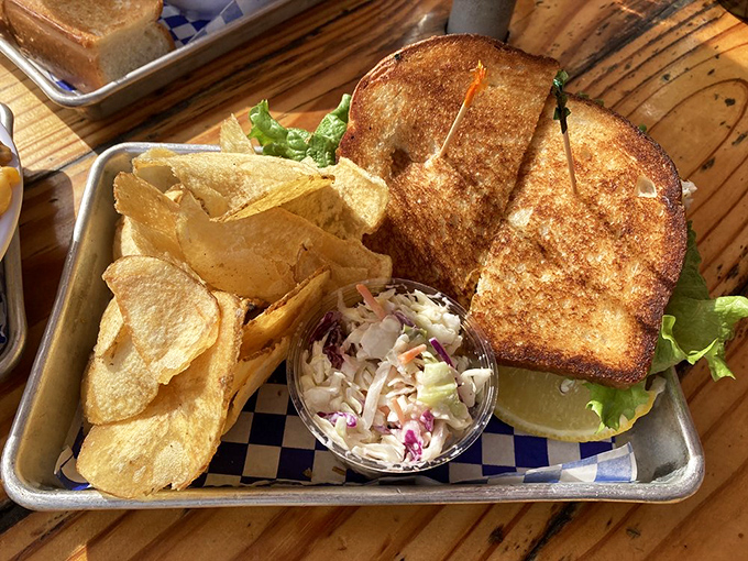 This grilled sandwich isn't just lunch&mdash;it's edible architecture. Golden-brown bread supporting the delicate balance of seafood and crisp lettuce.
