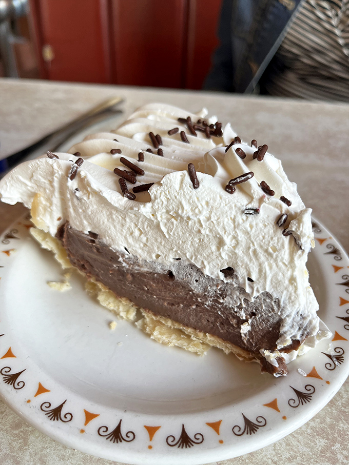 Chocolate cream pie with a cloud of whipped topping and chocolate sprinkles&mdash;proof that heaven exists on earth.