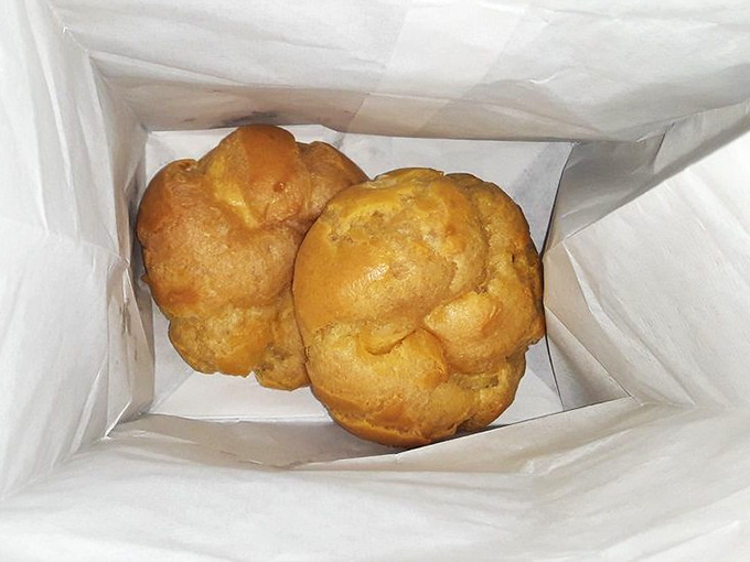 These cream puffs aren't just pastries; they're time machines to childhood memories when dessert was the ultimate reward for eating your vegetables.