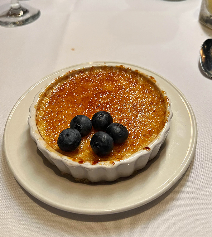 The cr&egrave;me br&ucirc;l&eacute;e's crackling sugar top gives way to silky custard beneath&mdash;like breaking through ice on a pristine winter pond.