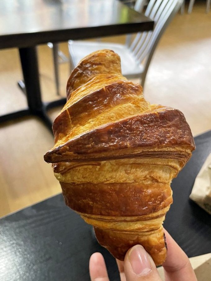 A croissant so perfectly laminated, it should be hanging in the Louvre instead of tempting mortals.