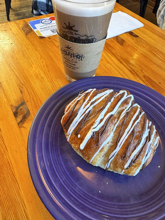 This isn't just a pastry; it's a buttery, flaky work of art drizzled with icing that makes you want to high-five the baker.