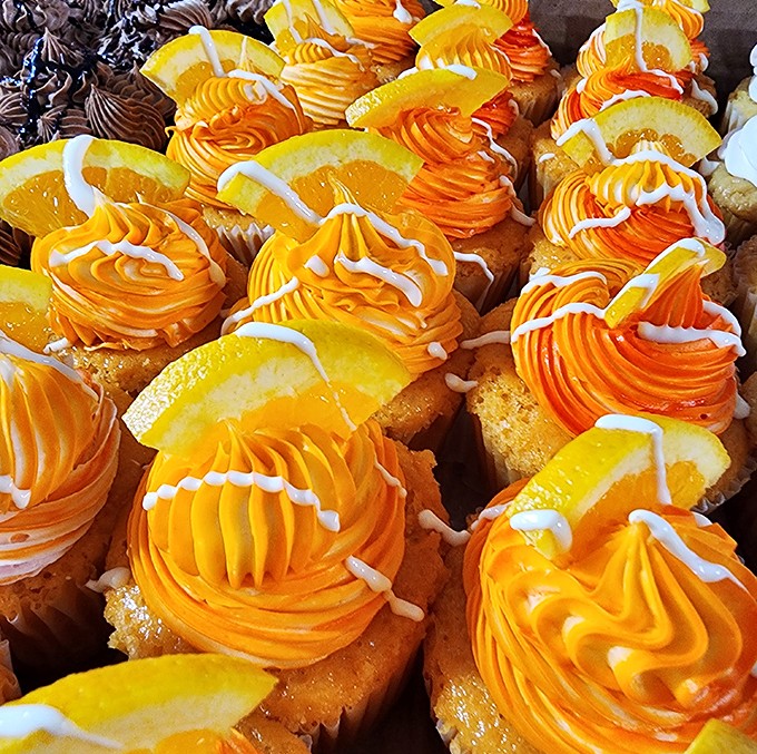 These cupcakes aren't just desserts, they're tiny orange-topped masterpieces that would make even the most dedicated dieter whisper, "Worth it."