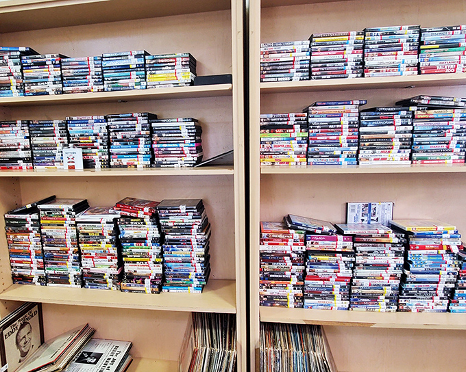 Hollywood history by the pound! These DVD stacks are like archaeological layers of our collective entertainment past.