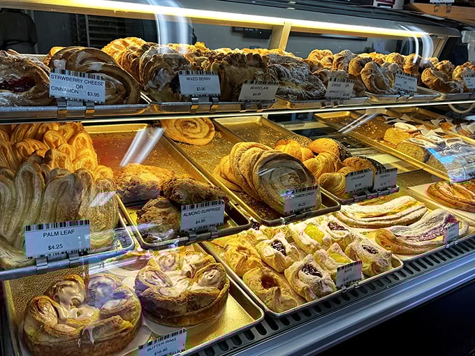 Danish pastries lined up like edible jewels in a bakery treasure chest. Each one whispers, "Diet? What diet? We don't know her."