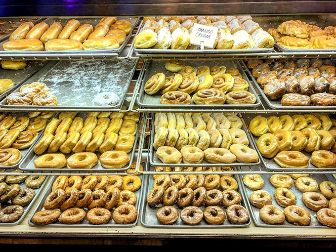 Donut heaven exists, and it's arranged in neat rows behind glass. This display case is what dietitians see in their nightmares and what the rest of us see in our dreams.
