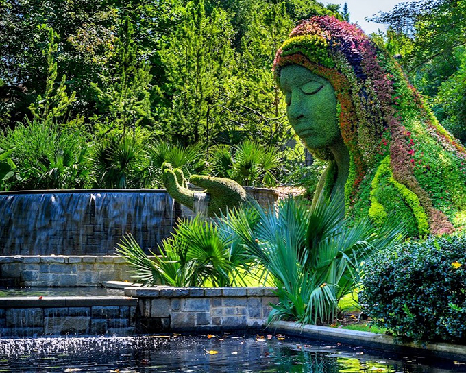 Serenity personified&mdash;the Earth Goddess rests beside cascading waters, her face a canvas of living plants changing with each passing season.