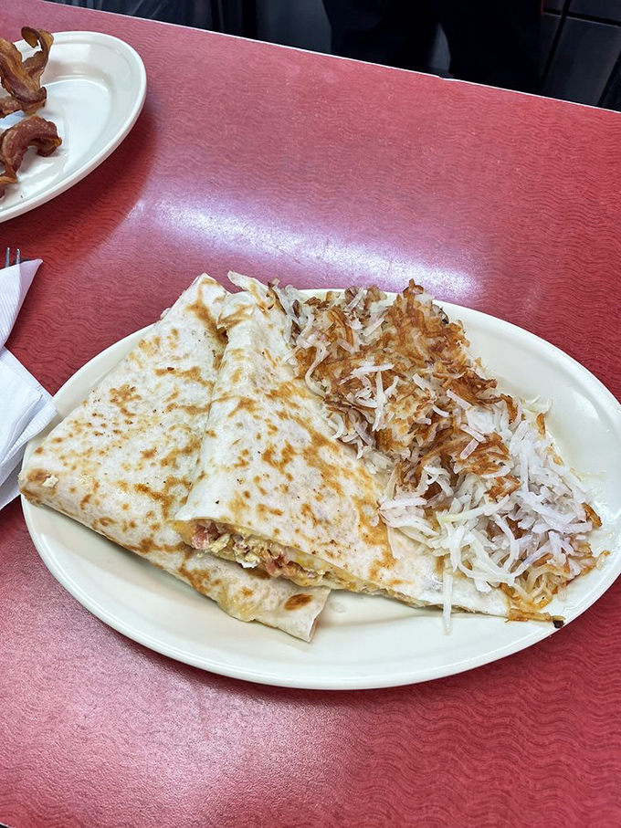 The humble quesadilla gets the breakfast treatment, with crispy edges giving way to melty goodness inside. Hash browns standing by for backup.