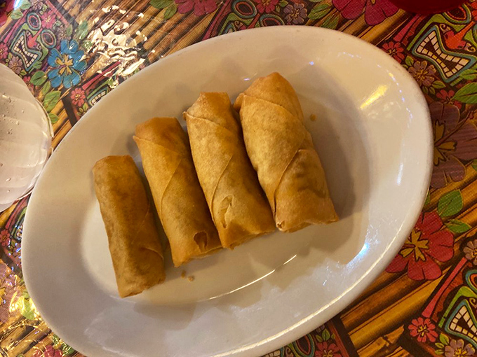 Golden, crispy egg rolls lined up like delicious soldiers, ready to sacrifice themselves to your appetite. The perfect first bite of any tiki feast.