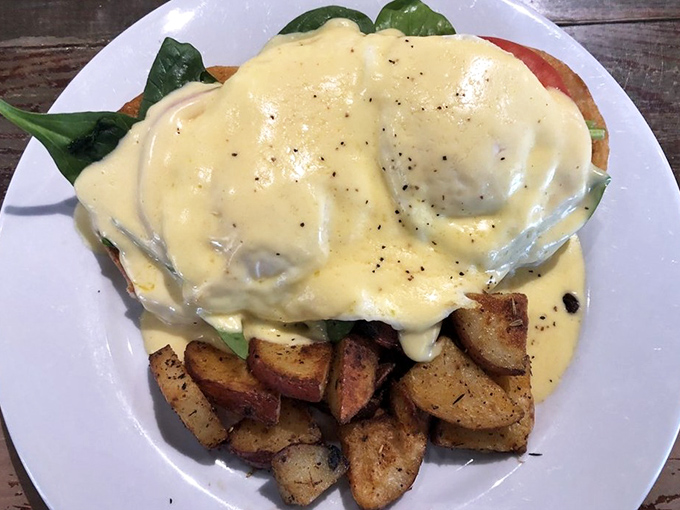 This Eggs Benedict isn't just breakfast&mdash;it's a sunrise ceremony where hollandaise sauce performs sacred rituals over perfectly poached eggs.