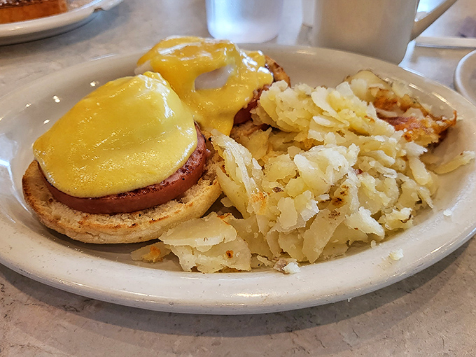 Eggs Benedict that would make a brunch enthusiast weep with joy. That hollandaise sauce is practically performing a victory dance.