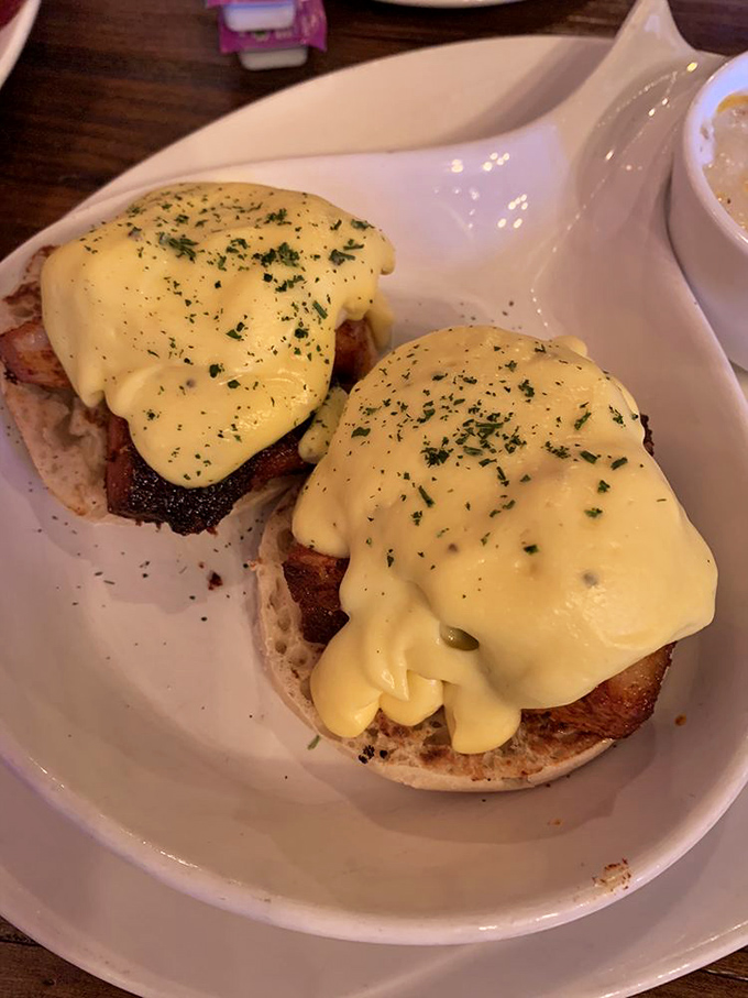 Eggs Benedict done right&mdash;English muffins supporting perfectly poached eggs beneath a sunshine-yellow hollandaise blanket. Breakfast architecture at its finest.