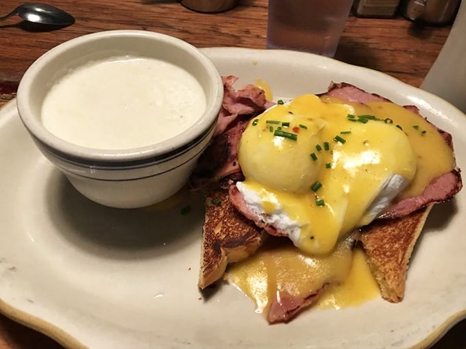 Eggs Benedict reimagined with thick-cut ham and hollandaise that cascades like a golden waterfall. Comfort food elevated to art form.
