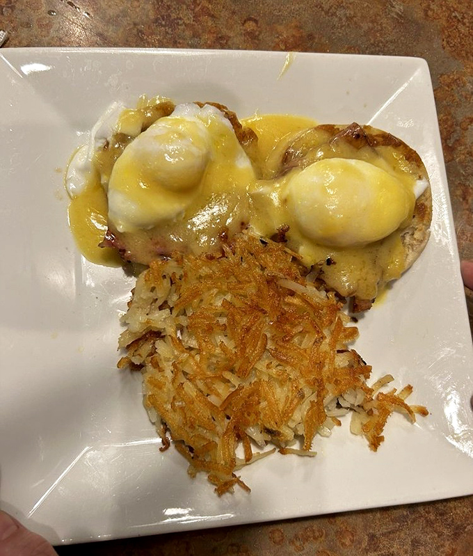 Eggs Benedict that would make a brunch snob weep with joy, paired with hash browns so perfectly crispy they deserve their own fan club.