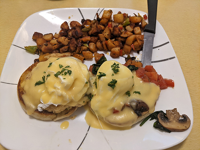 Eggs Benedict that would make the Pope jealous, with hollandaise cascading like a yellow waterfall over English muffin mountains.