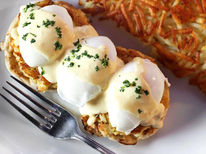 These Eggs Benedict aren't just breakfast, they're performance art &ndash; perfectly poached eggs perched atop crispy crab cakes like synchronized swimmers in hollandaise.