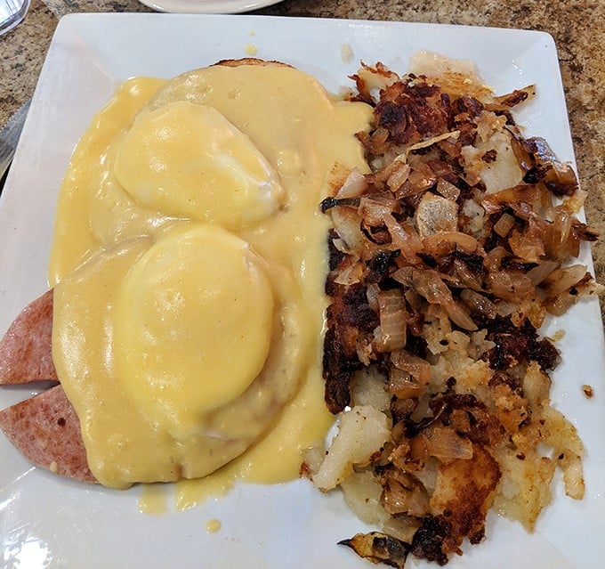 Eggs Benedict done right &ndash; those perfectly poached eggs draped in hollandaise like they're wearing sunshine-colored evening gowns.