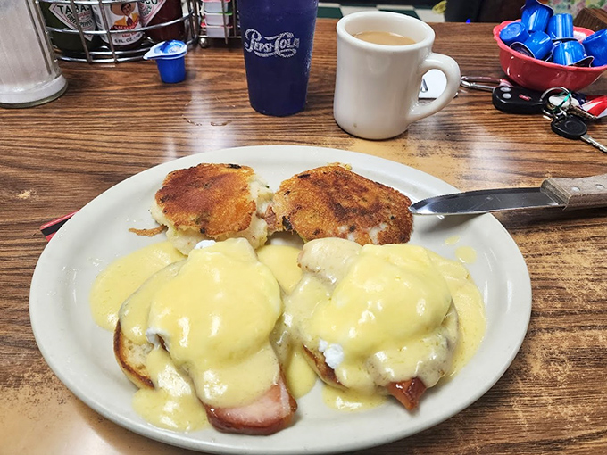 Eggs Benedict done right—Canadian bacon, perfectly poached eggs, and hollandaise sauce that would make a French chef nod in reluctant approval.