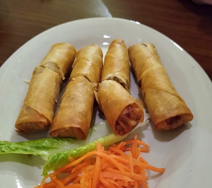Crispy egg rolls that shatter at first bite, revealing savory filling that pairs perfectly with that addictive dipping sauce on the side.