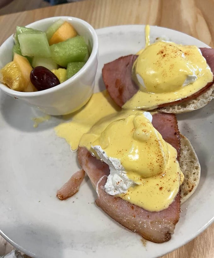 Eggs Benedict done right: perfectly poached eggs, quality ham, and hollandaise sauce that would make a French chef weep with joy.